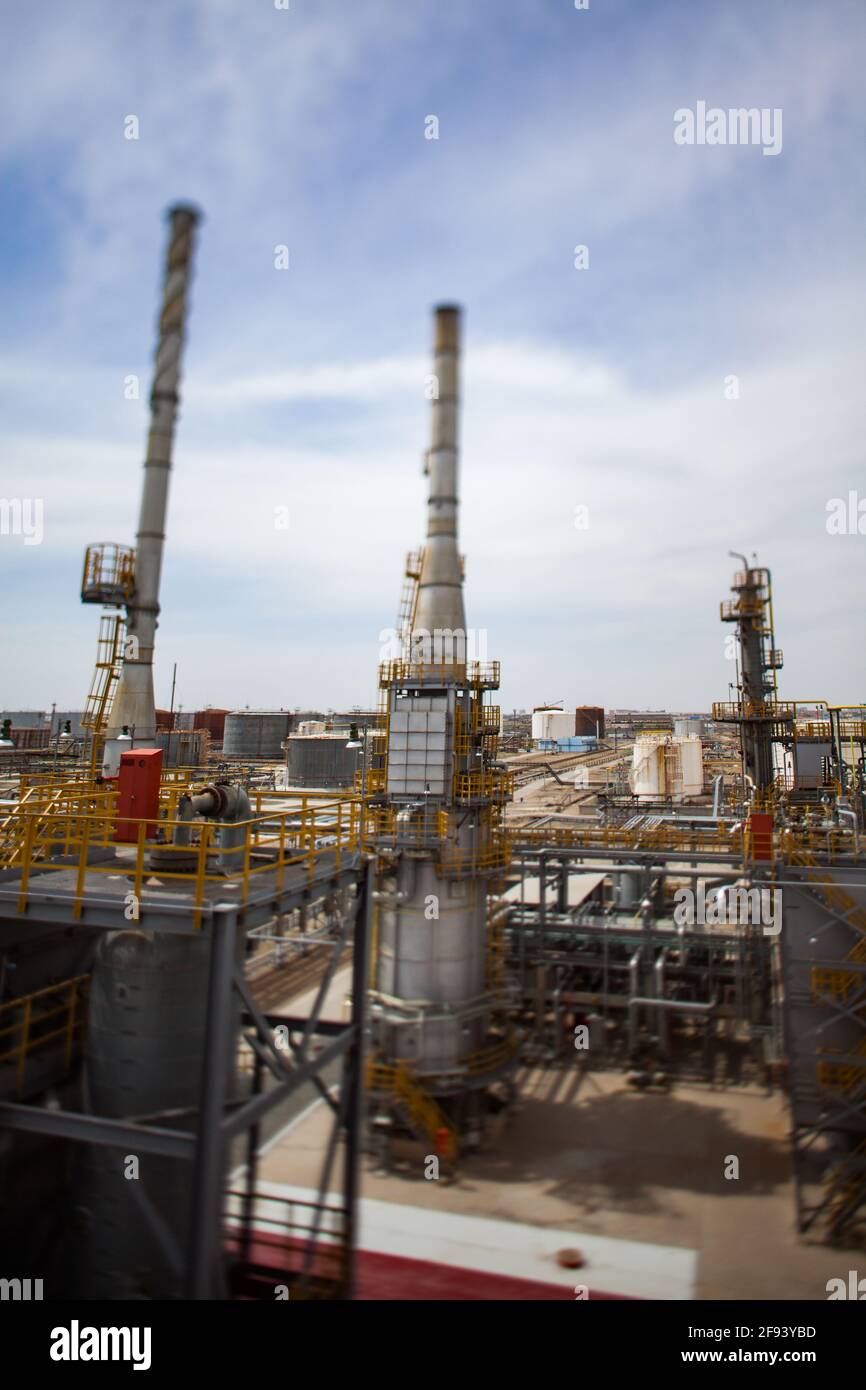 Oil refinery complex in desert. columns and chimneys. Tilt-shift ...