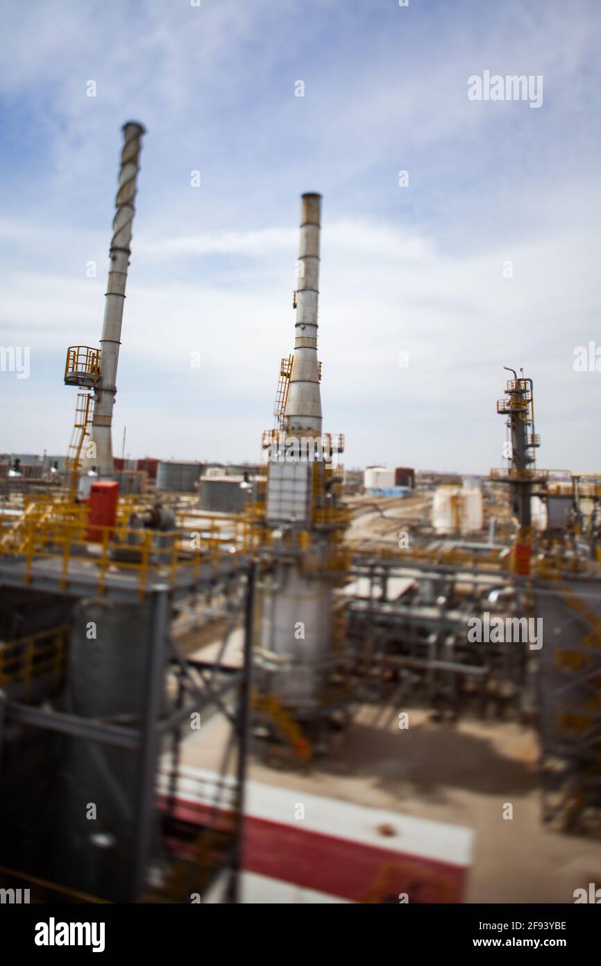 Oil refinery plant in a desert. Refinery column, and plant chimney ...