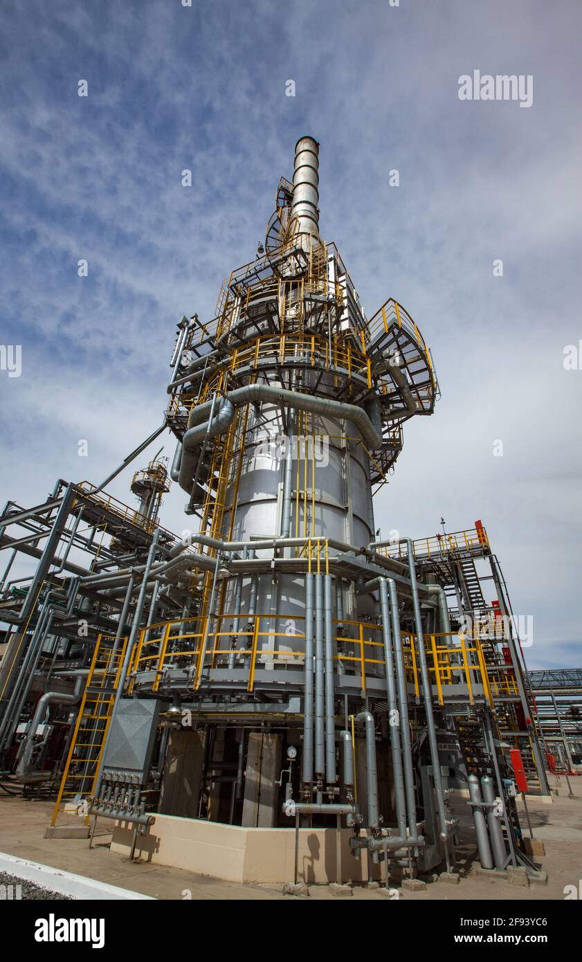 Oil refinery plant in desert. On blue sky with clouds.Distillation ...