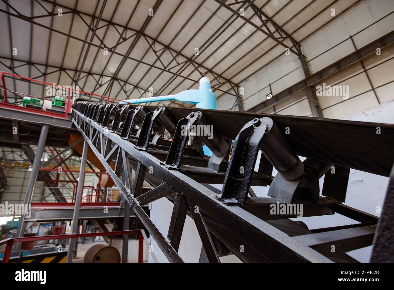 Factory workshop and glass recycling equipment.Conveyor transporter ...