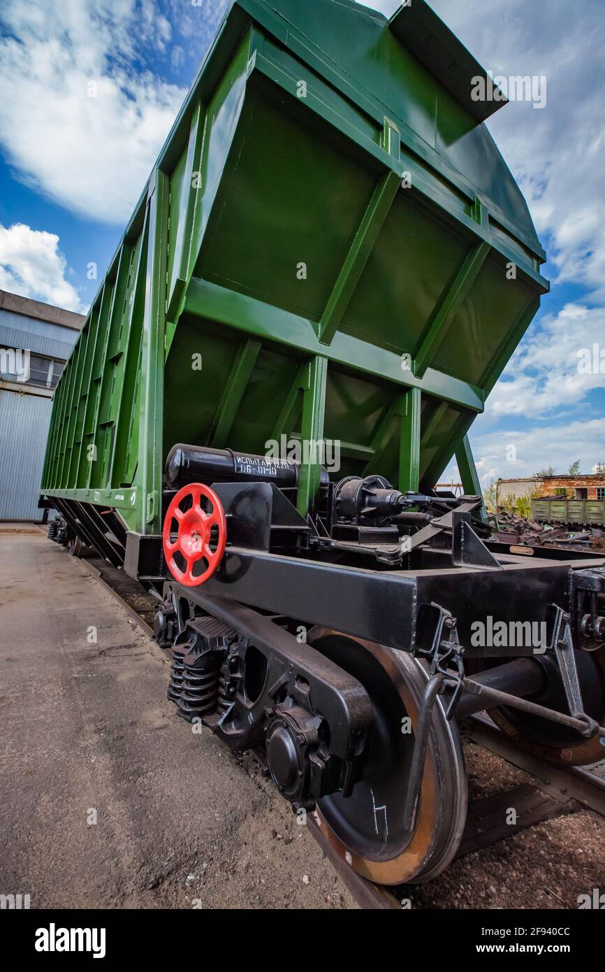 Train car-building plant. New green railroad hopper car. Red valve ...