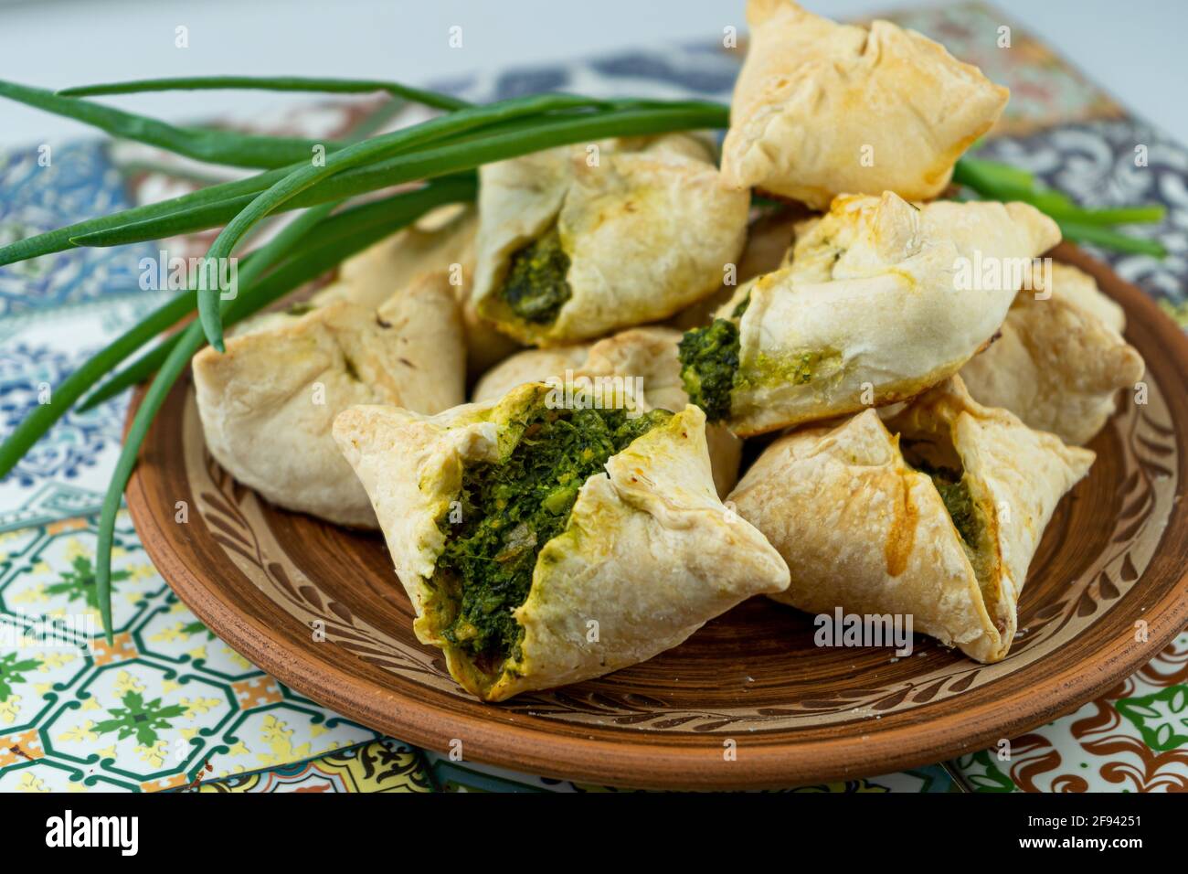 Pies with wild garlic and green onions. Homemade food. Puff pastry ...