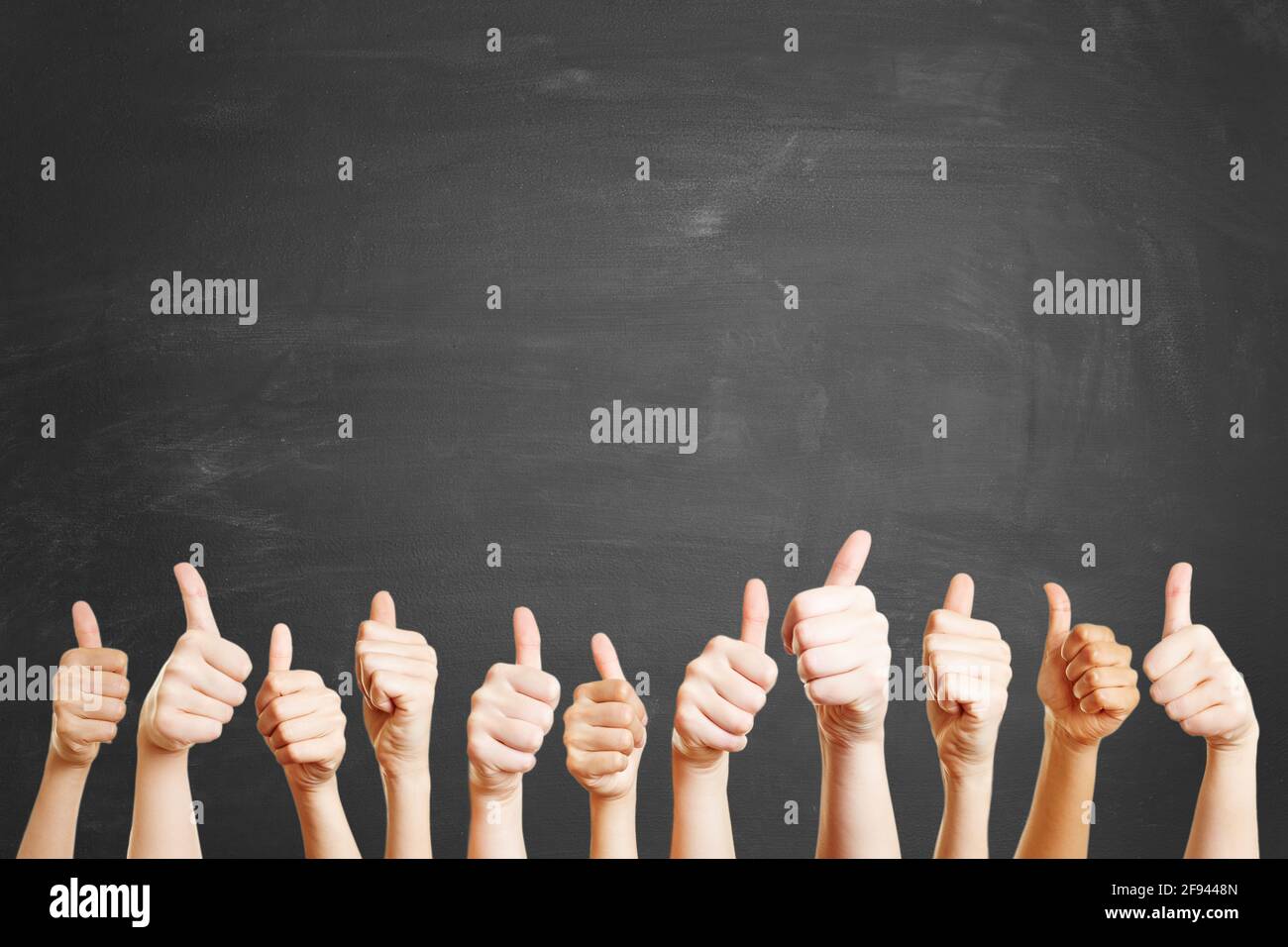 Hands in front of blackboard with like sign Stock Photo - Alamy