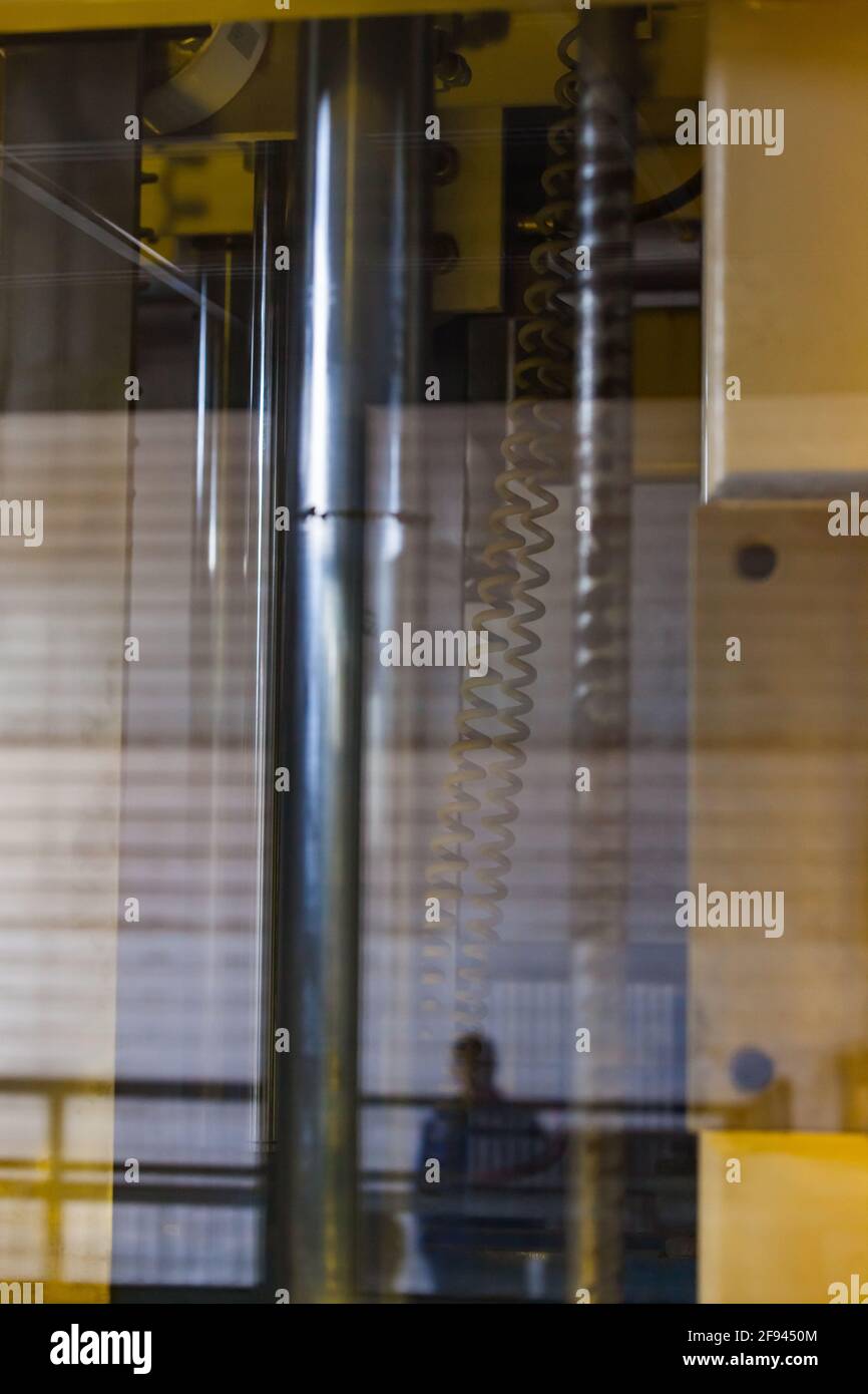 Abstract industrial background. Reflection of machine parts in glass ...