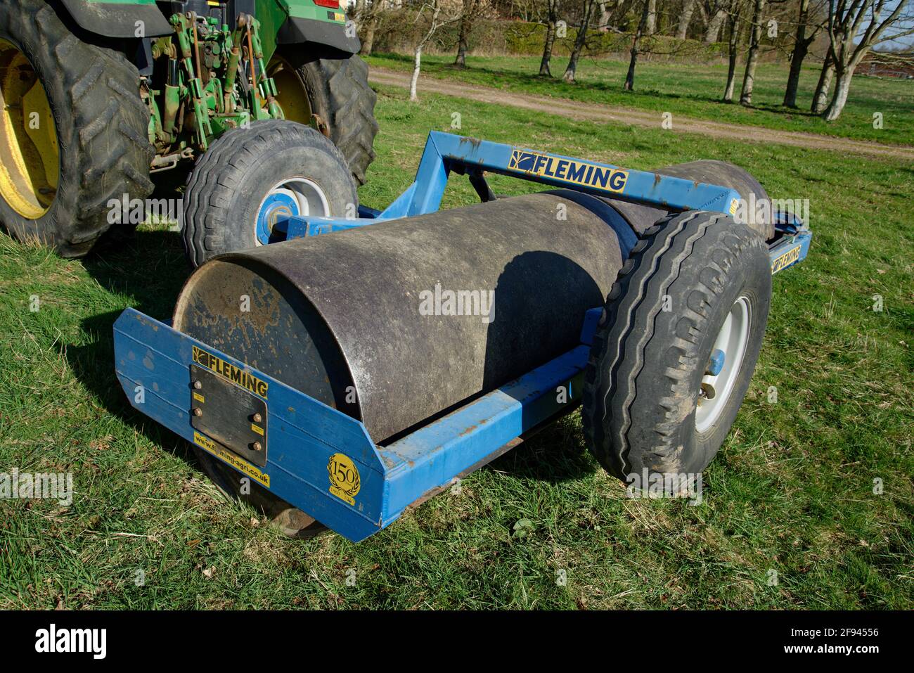 A tractor with a heavy 5 ton roller pulled behind. A job to be done on ...