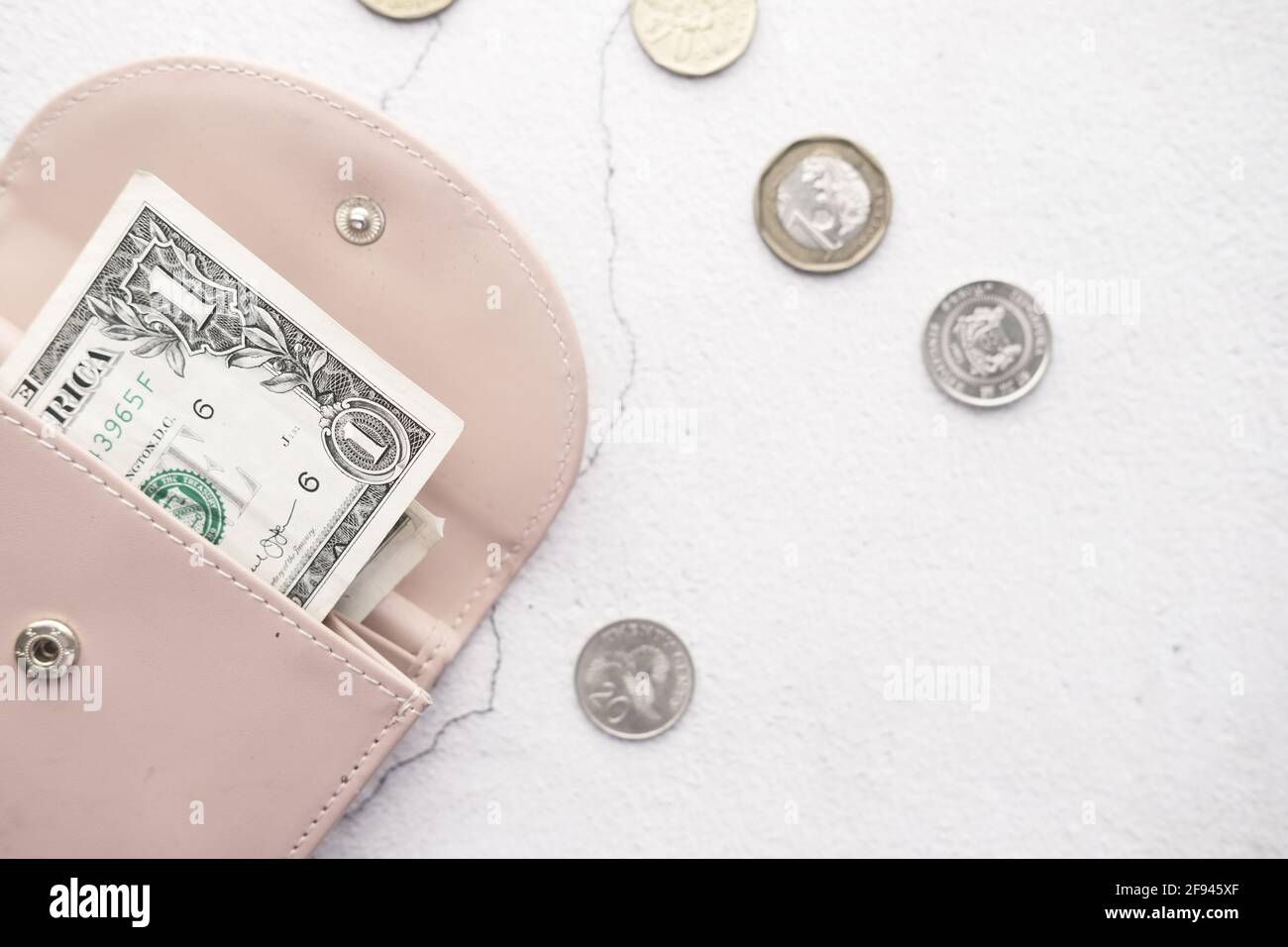 One dollar cash in leather on white background Stock Photo - Alamy
