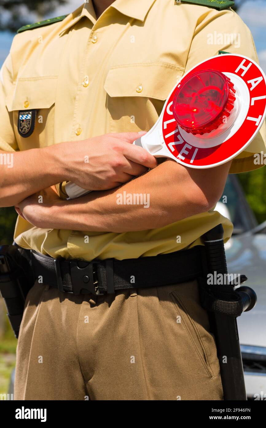 Police - policeman or cop in uniform stop car in traffic control Stock ...