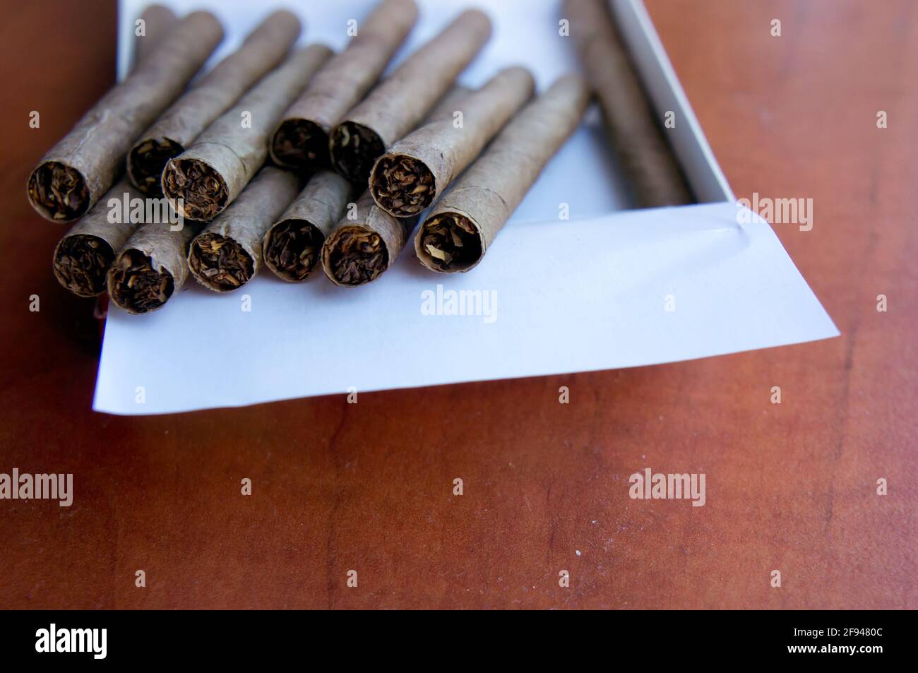 Cigars in a box on table Stock Photo - Alamy