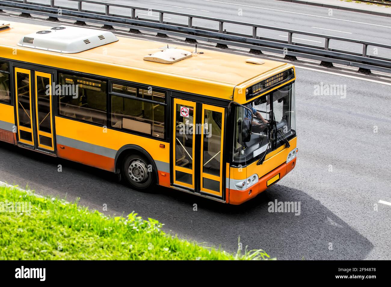 Yellow City Bus Moves along the Highway. View from above Stock Photo ...