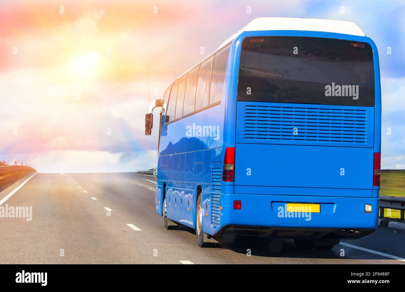 Tourist Bus Moves on Country Road Stock Photo - Alamy