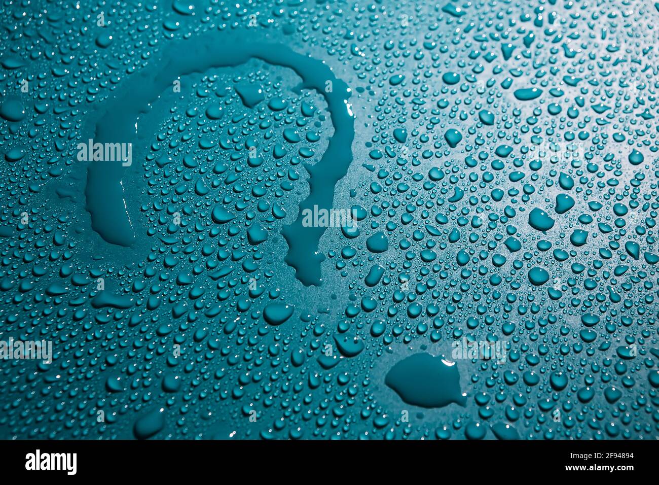 Question mark is written with water surrounded by drops of water. Close ...