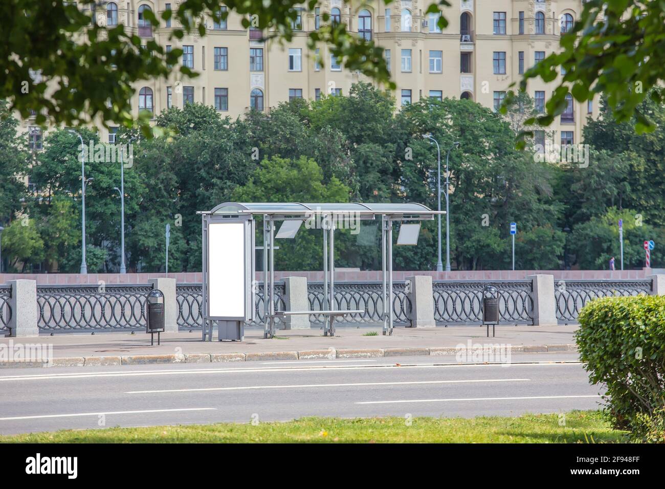 modern bus stop with advertising banner Stock Photo - Alamy