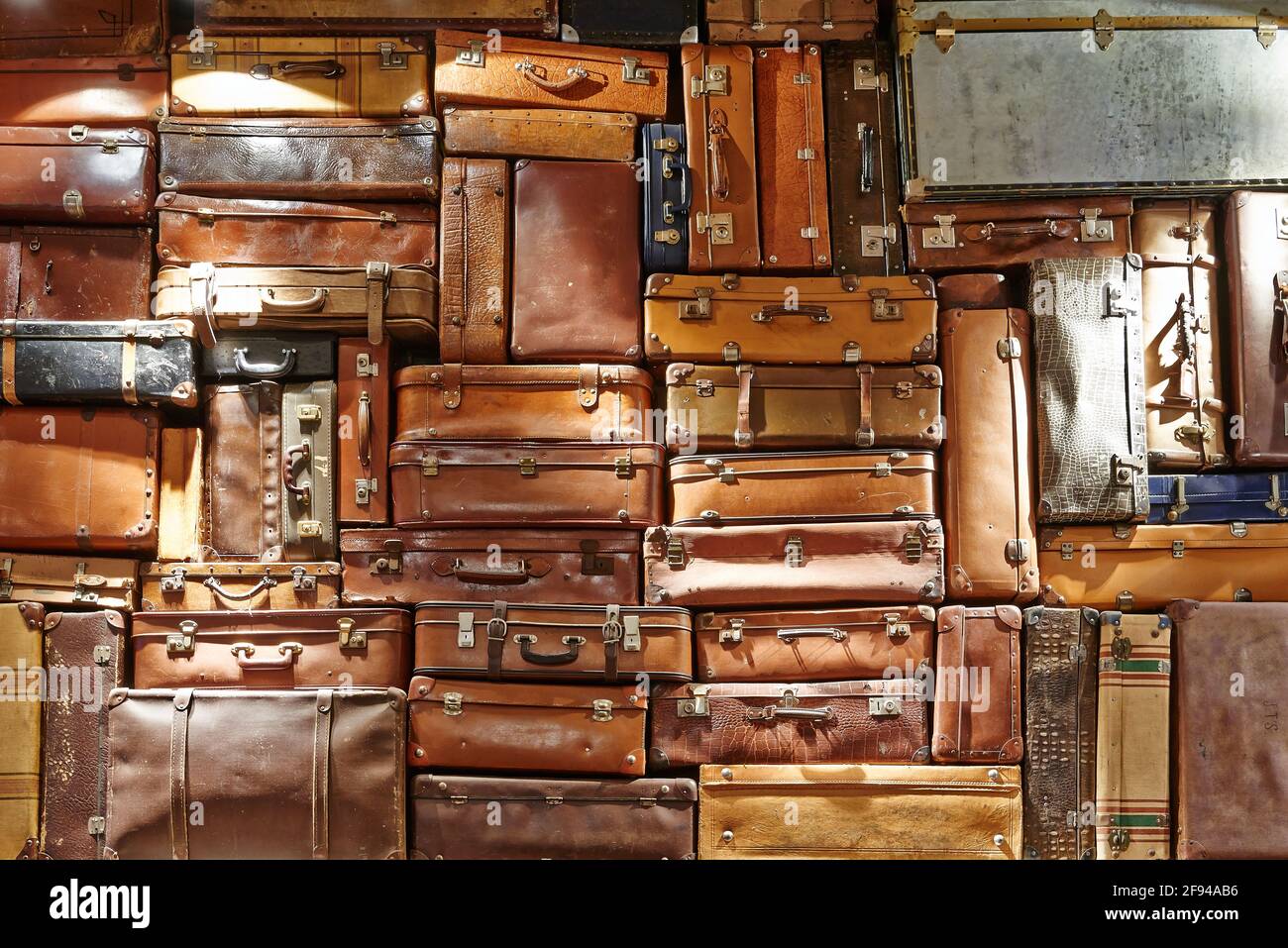 Wall of ancient and aged luggage. Ideal for background Stock Photo - Alamy