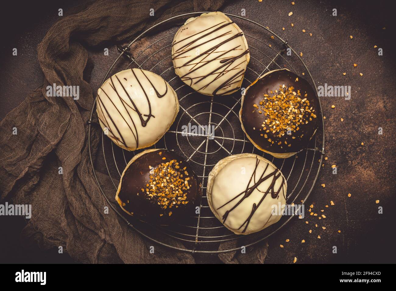 Traditional german Berliner pastries glazed with dark and white ...