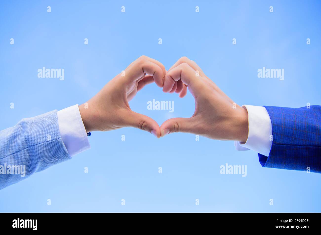 Hand heart gesture forms shape using fingers. Male hands in heart shape ...