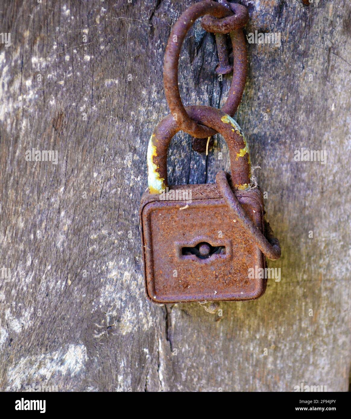Old and rusty metal lock on metal hoop Stock Photo - Alamy