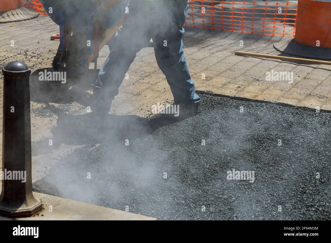 New road construction a repair asphalt covering while laying asphalt ...