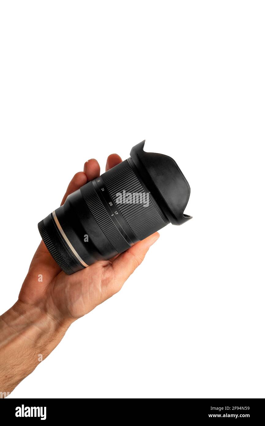 hand holding camera lens isolated on white background Stock Photo - Alamy