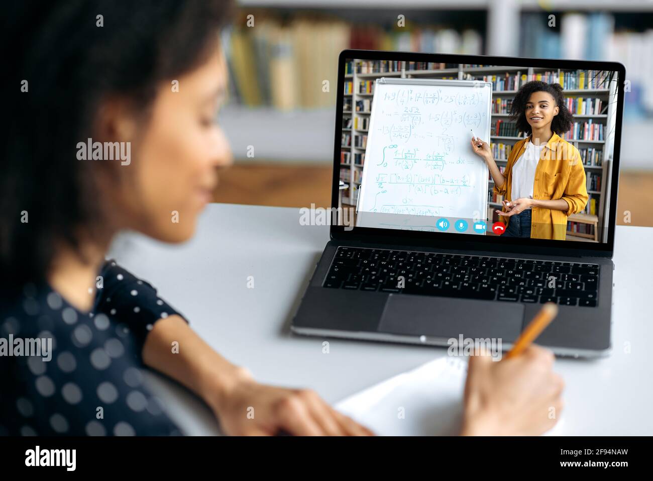 Female teacher discussing over laptop hi-res stock photography and ...