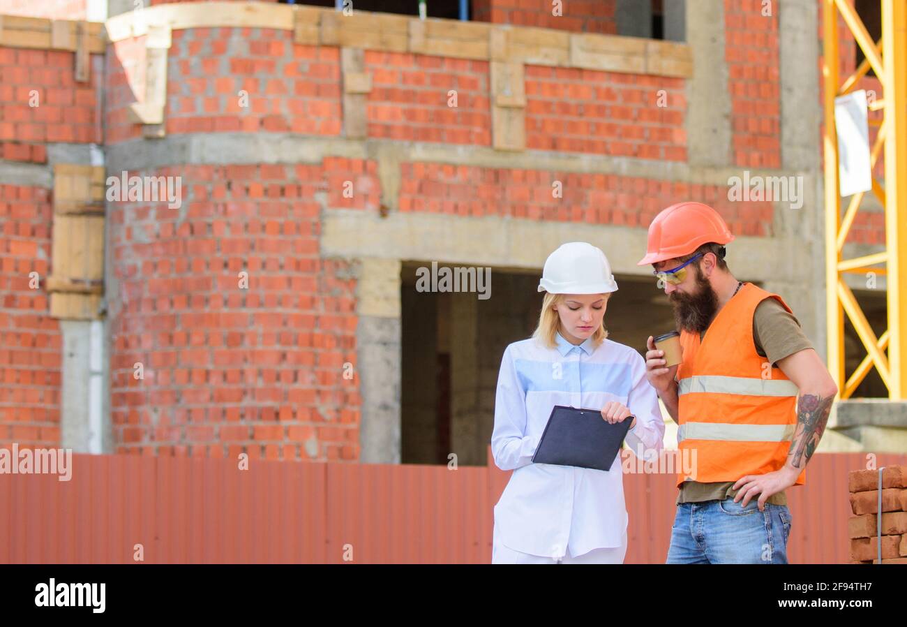 Construction team communication concept. Woman engineer and builder ...