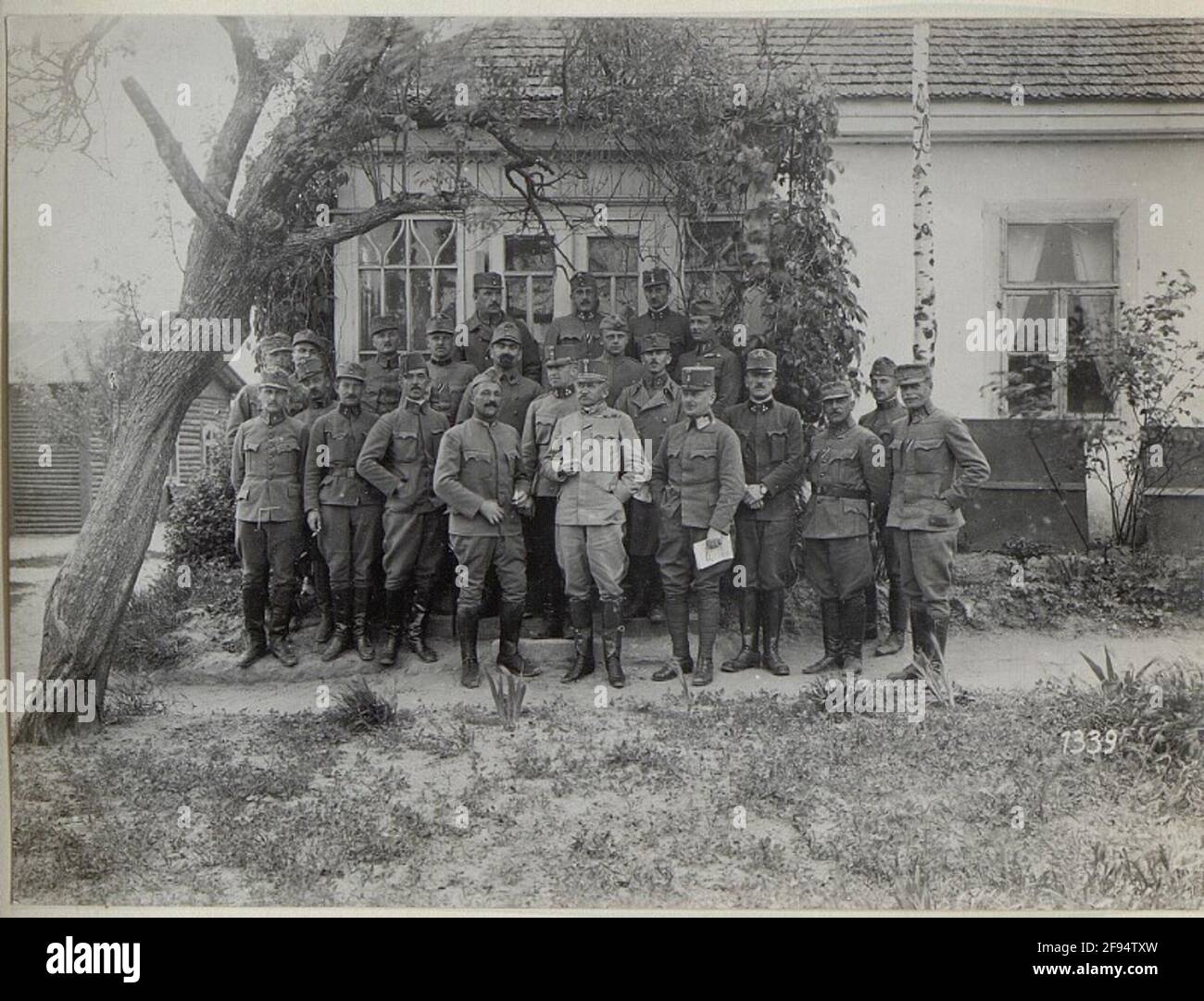 Officers and soldiers posing in front of a soldier home in the section ...