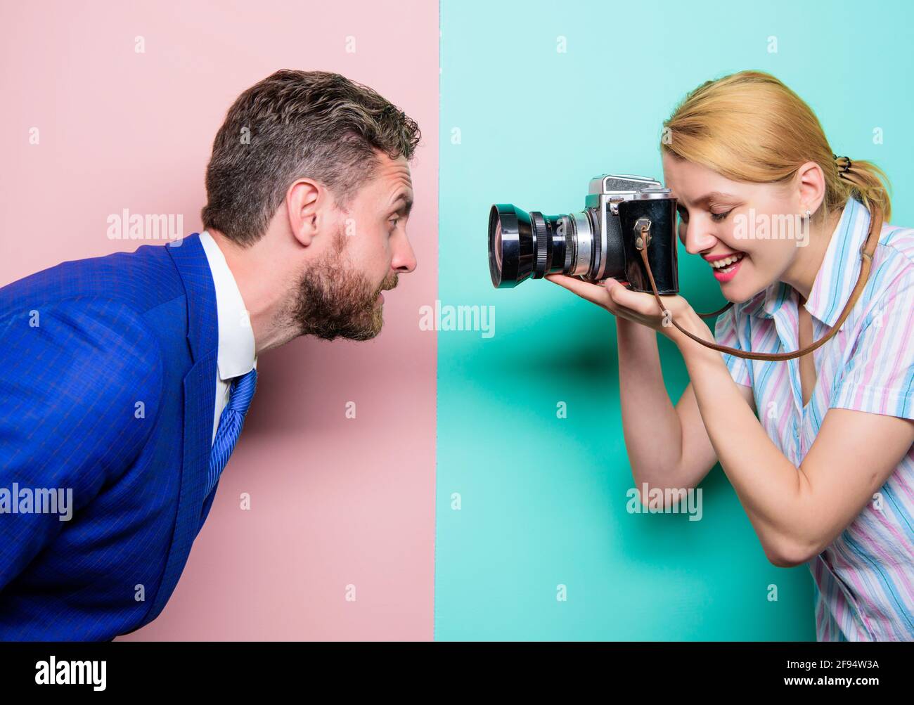 Enjoying photo shoot session. Photographer shooting male model in ...