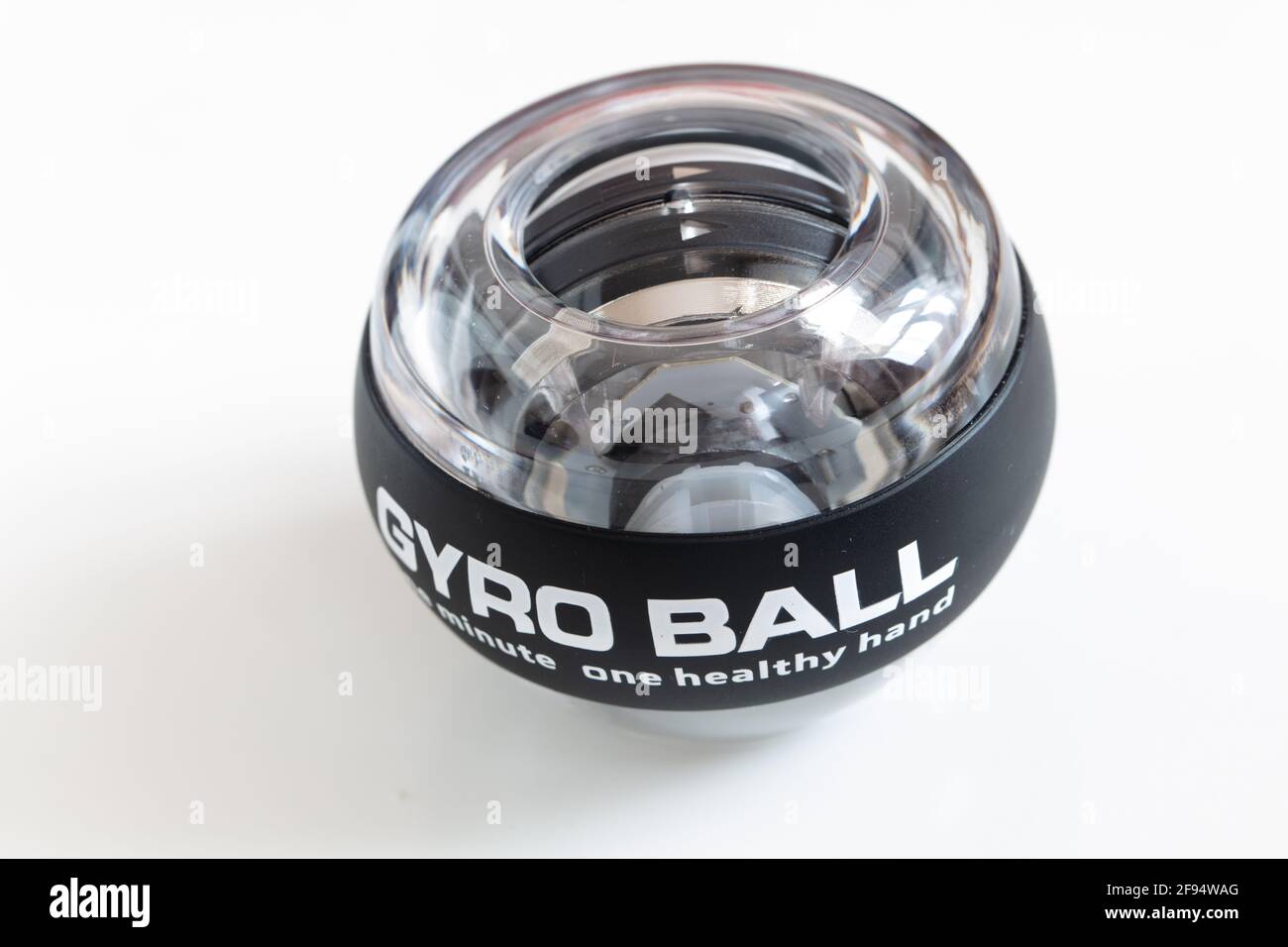 Transparent plastic gyroball on black background. Exercise equipment ...