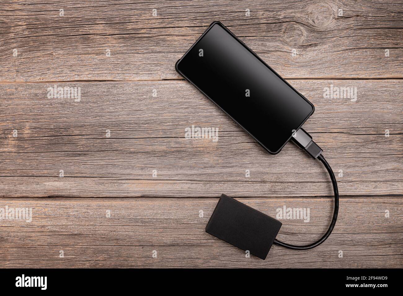 Memory card or external hard drive is connected to the smartphone via ...