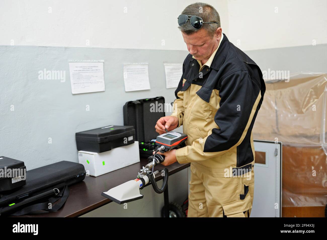 New radiation detector testing. Dosimetrist holding a portable gamma ...