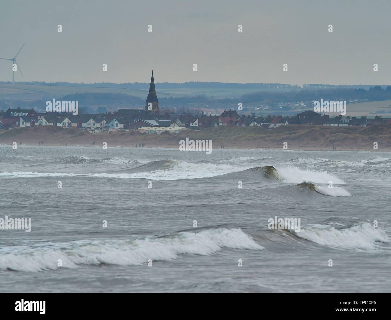Storm-blown breakers rolling into Redcar Beach, seen from South Gare ...