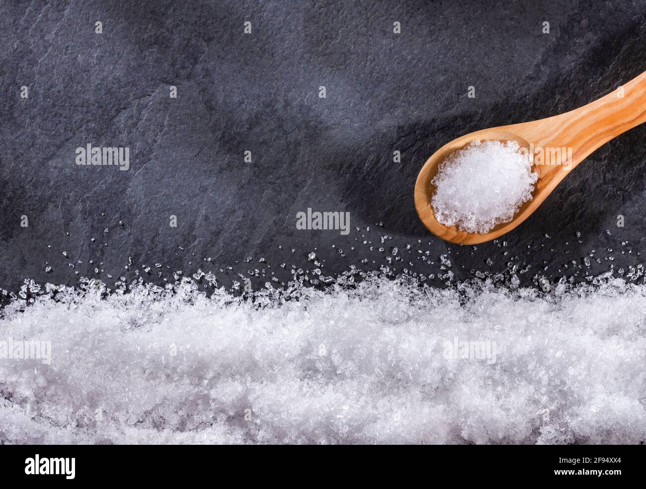 Magnesium chloride in wooden spoon - chemical component Stock Photo - Alamy