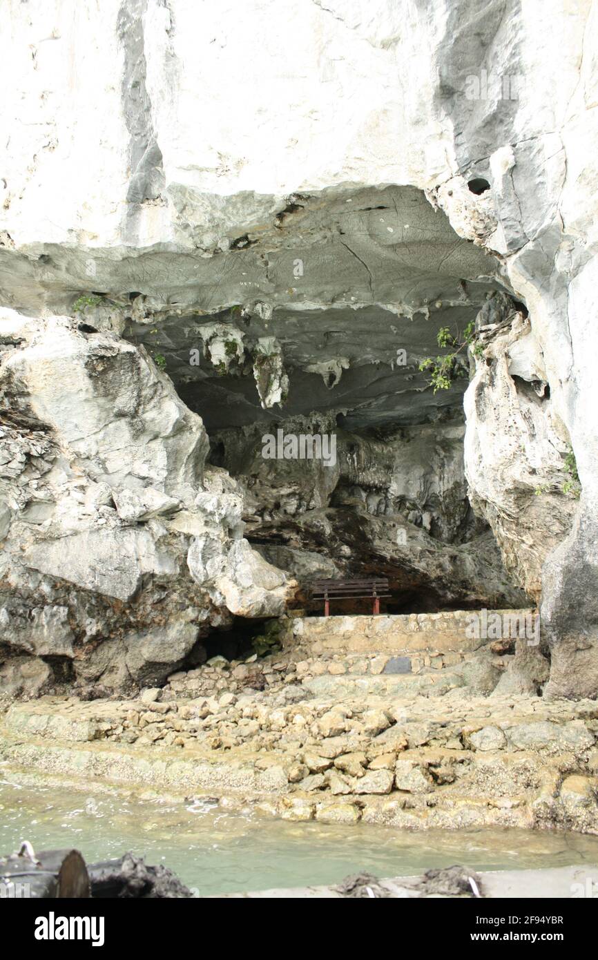 Photographs of an enclosed beach reached through an island cave in ...