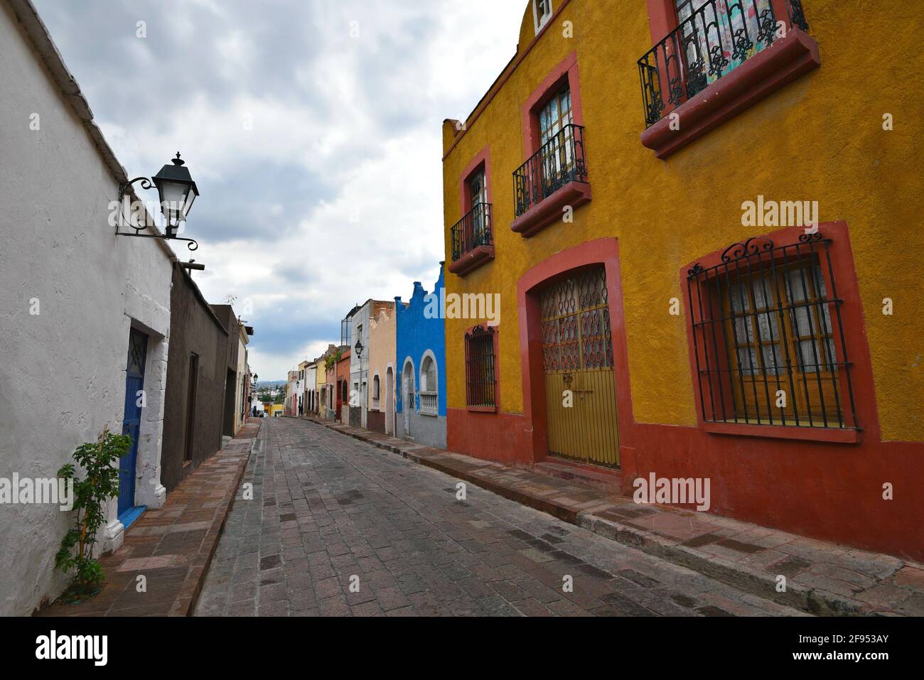 Colonial buildings with colorful stucco wall facades on the cobblestone ...