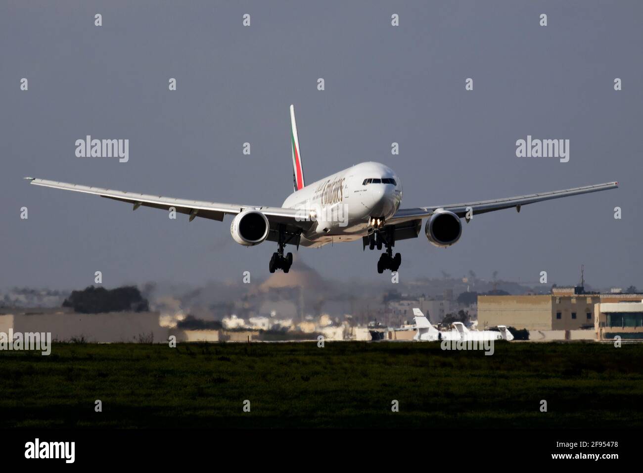 Emirates passenger plane at airport. Schedule flight travel. Aviation ...