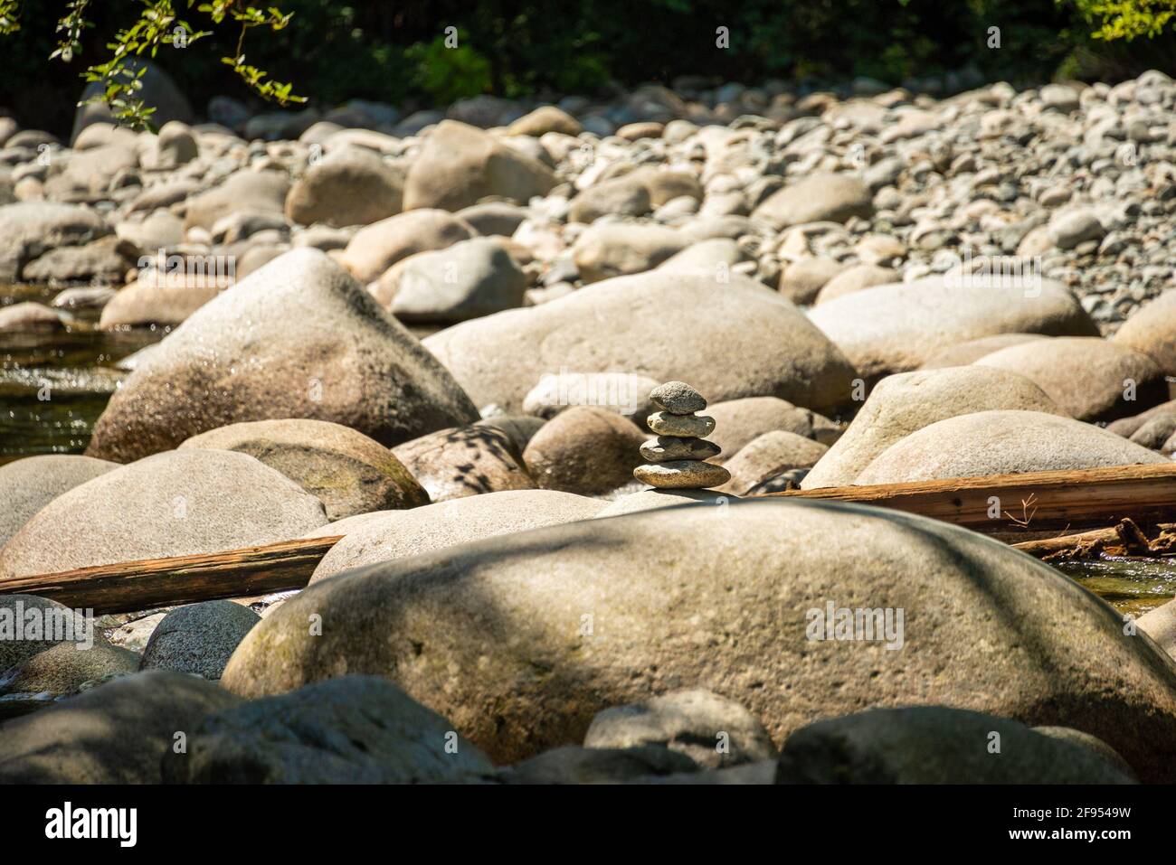 Small stone tower on dried waterway of montailn river Stock Photo - Alamy