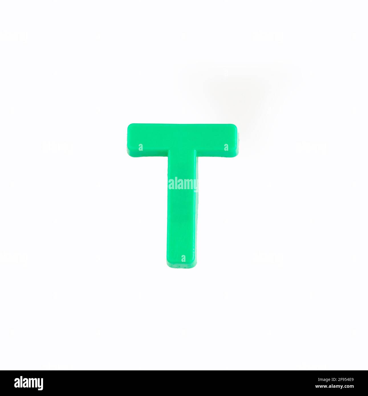 Letter T in green color - Plastic part Stock Photo - Alamy