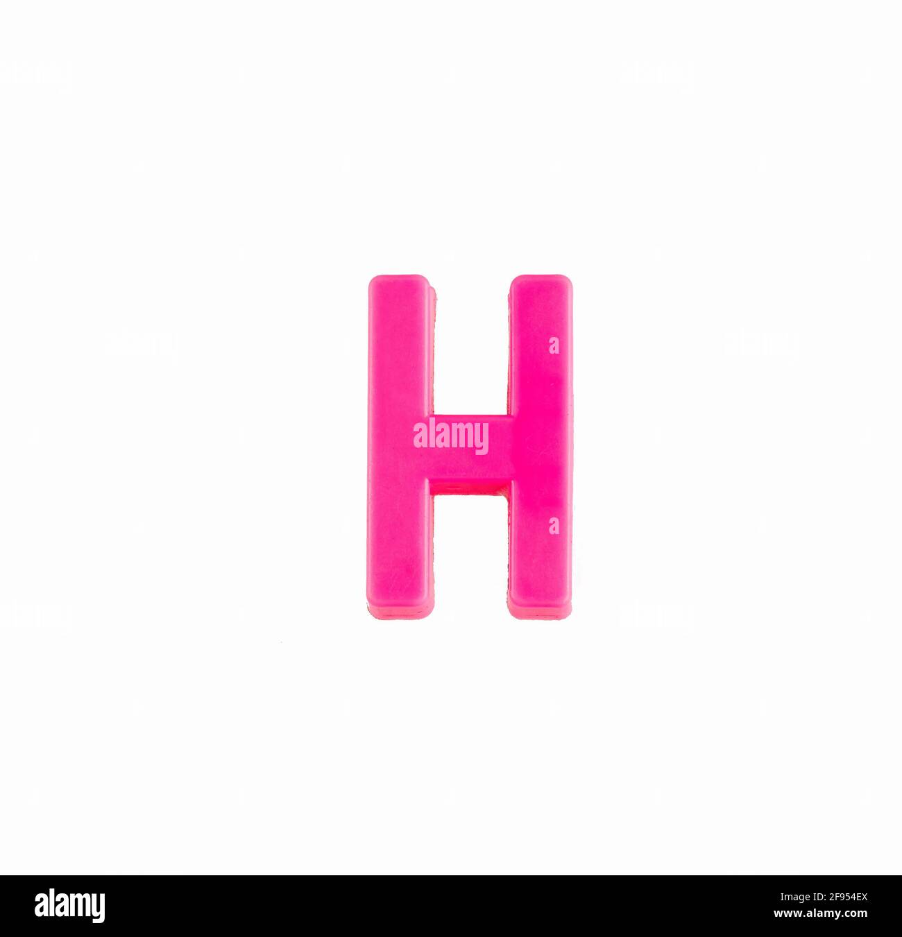 Letter H of the alphabet - Piece in pink plastic Stock Photo - Alamy