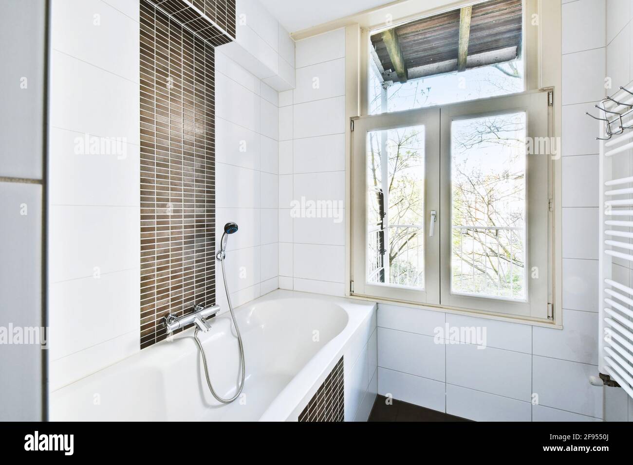 Interior of bathroom with window Stock Photo - Alamy