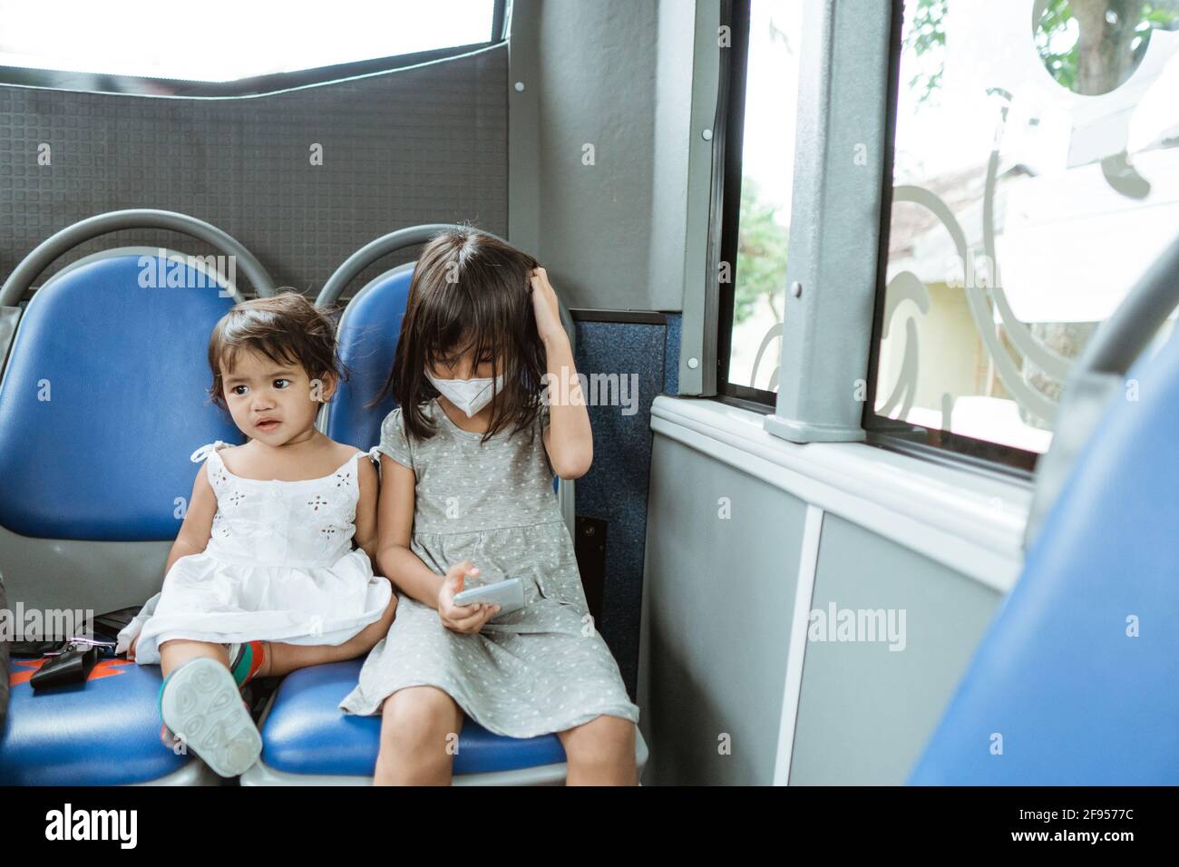 Two girls bus hi-res stock photography and images - Alamy
