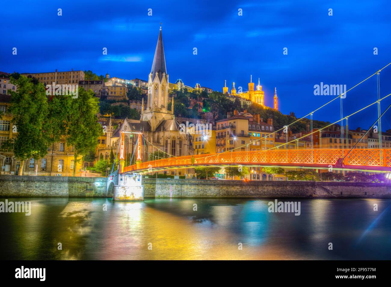 Night view of illuminated basilique de Notre-dame de Fourivere and ...