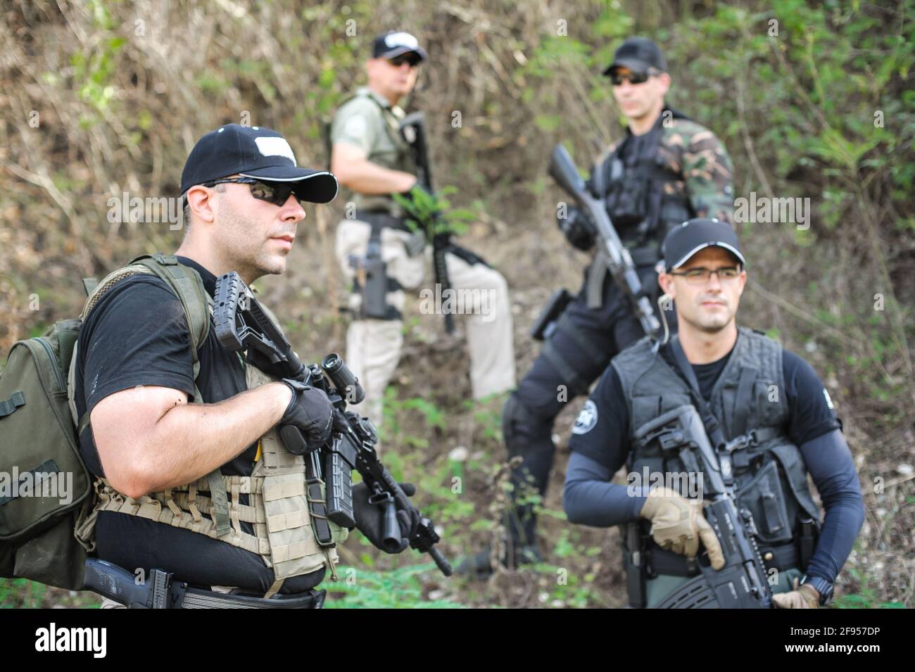 Military army soldiers in action tactical combat shooting from rifle ...