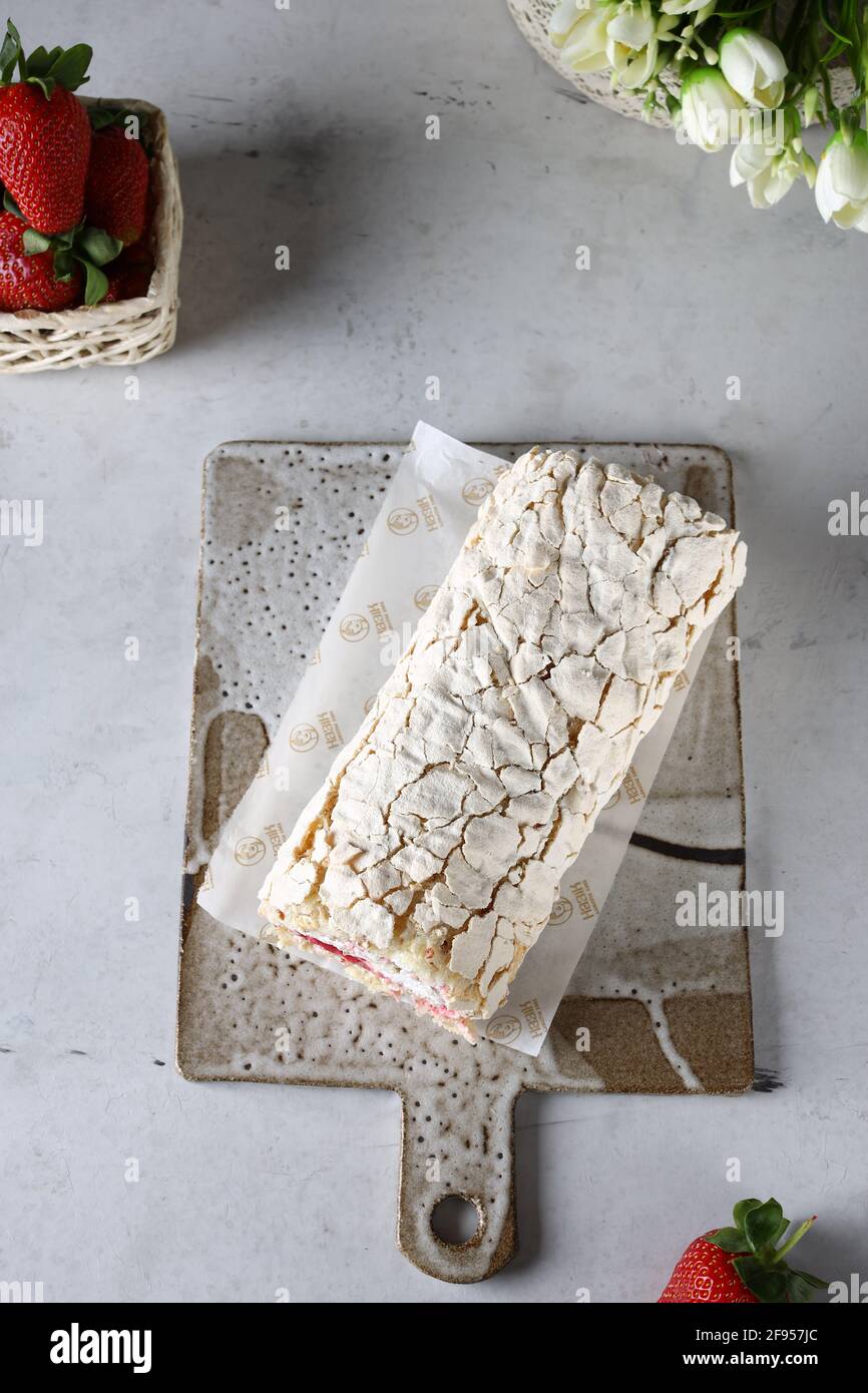 meringue roll with cream and berries dessert Stock Photo - Alamy