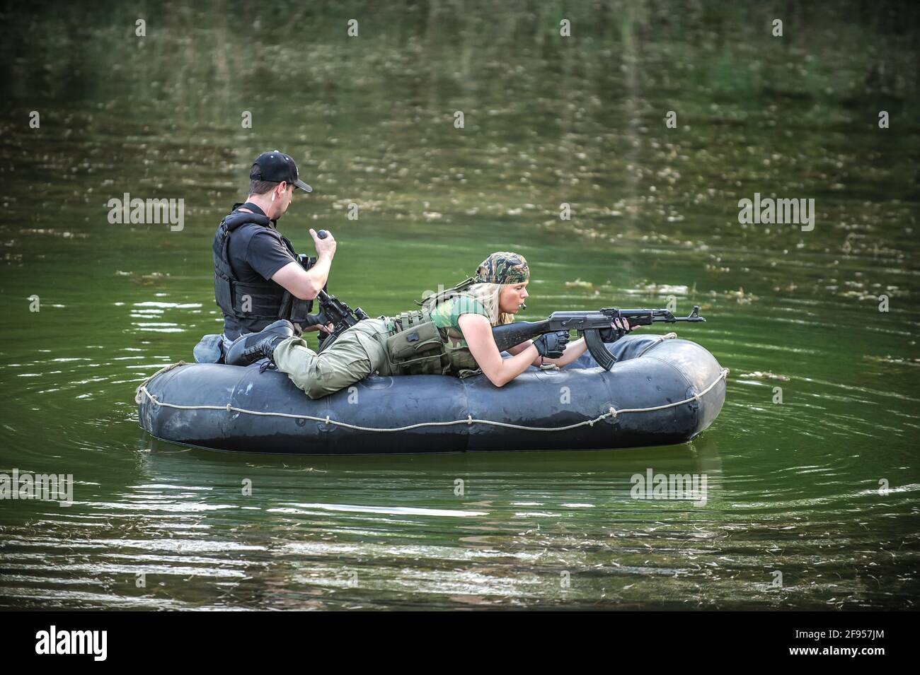 Soldier training. Special forces in camouflage uniforms paddling ...