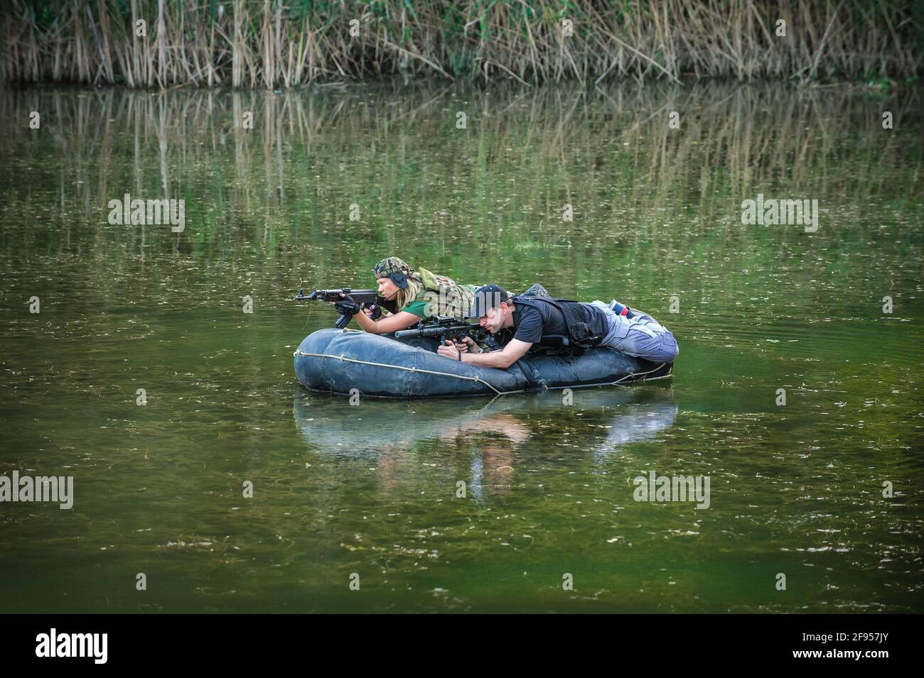 Soldier training. Special forces in camouflage uniforms paddling ...