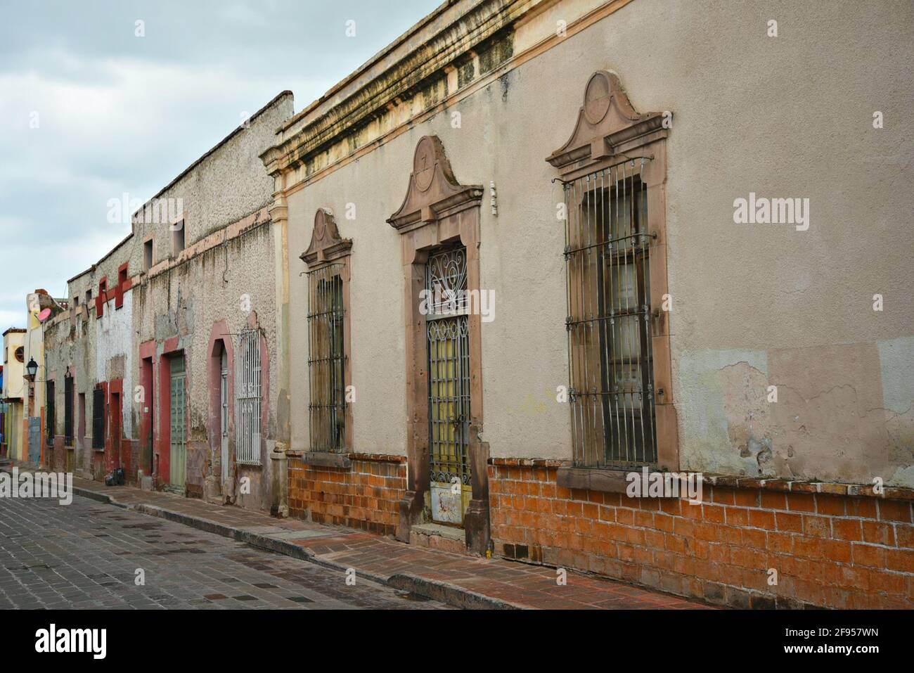 Colonial buildings on the cobblestone streets of Santiago de Querétaro ...