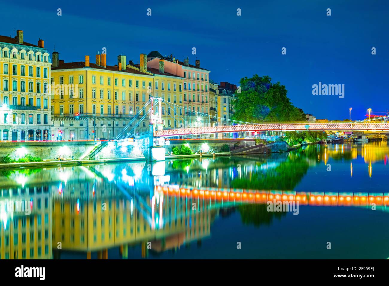 Night view of illuminated riverside of Saone river in Lyon, France ...
