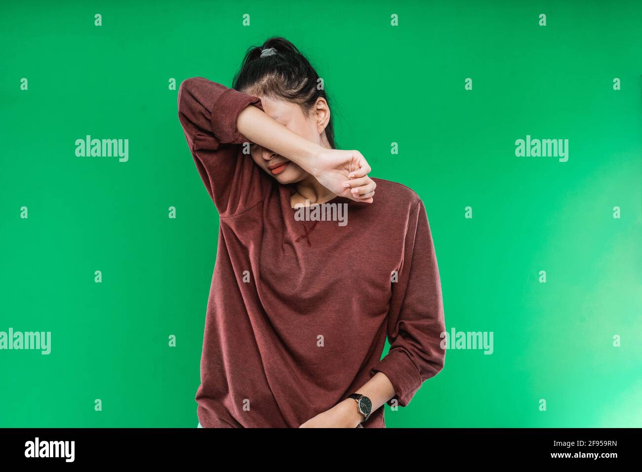 young woman crying while covering his face with his arms Stock Photo ...