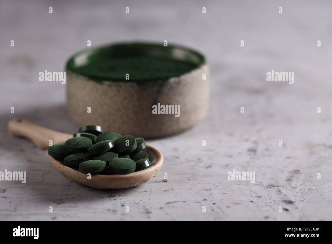 spirulina powder and superfood tablets Stock Photo - Alamy
