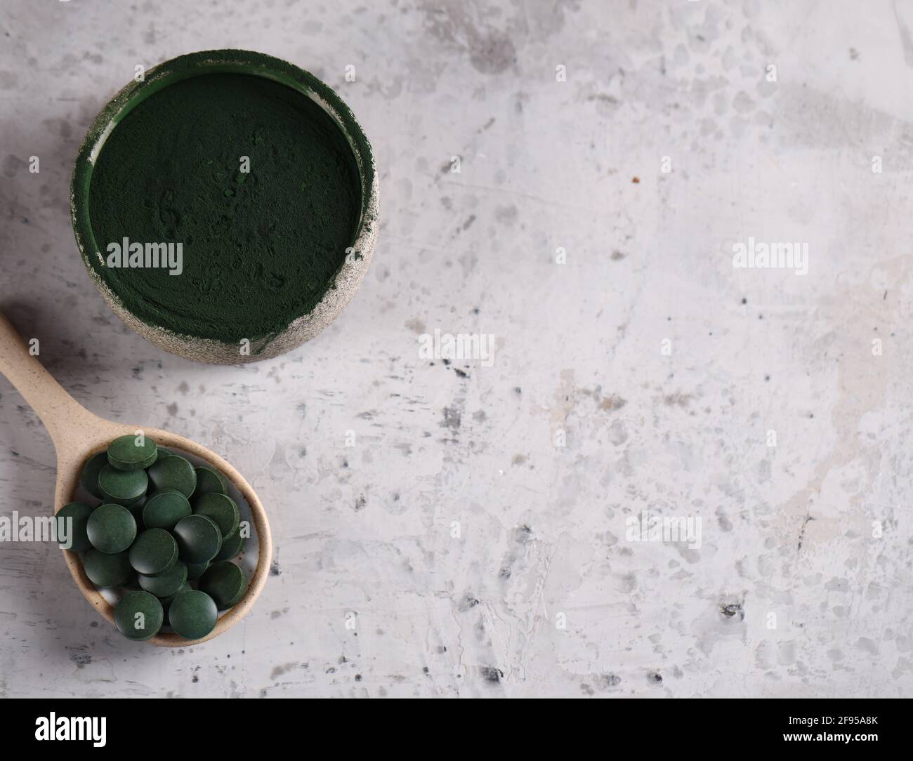 spirulina powder and superfood tablets Stock Photo - Alamy