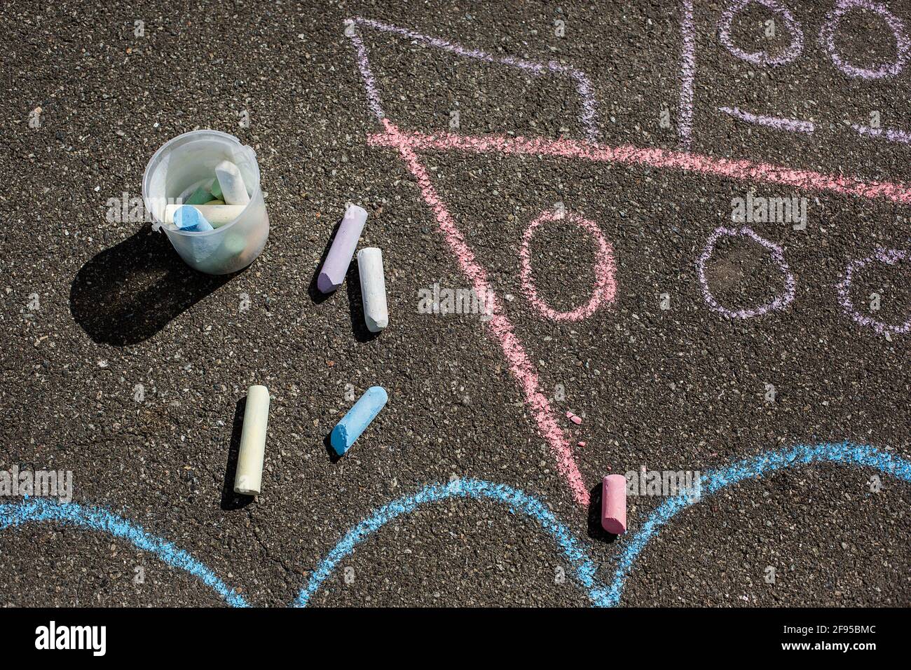 drawings on pavement. children's drawings with crayons on the pavement ...